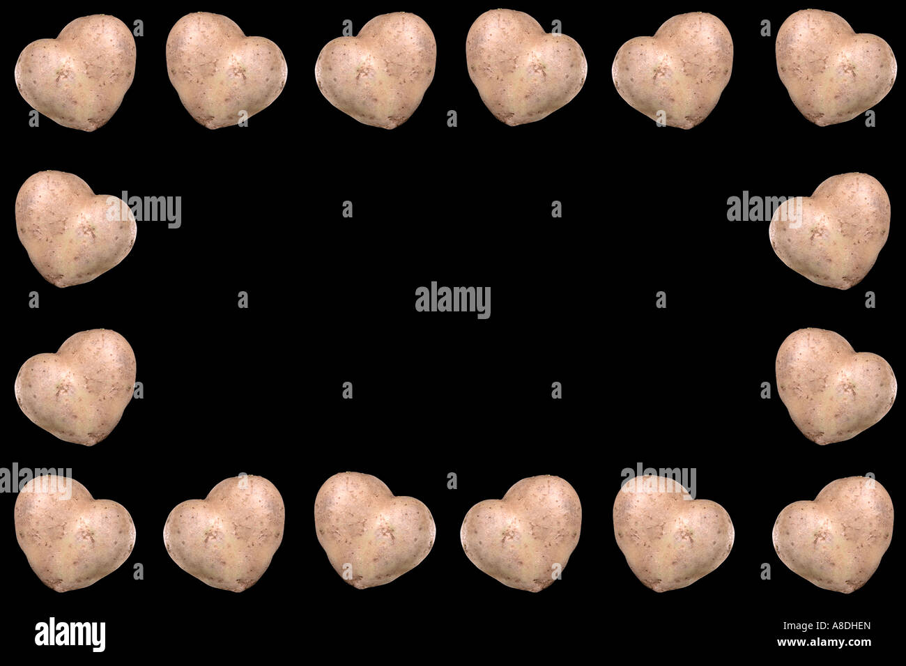Heart shaped potato border against a black background Stock Photo - Alamy