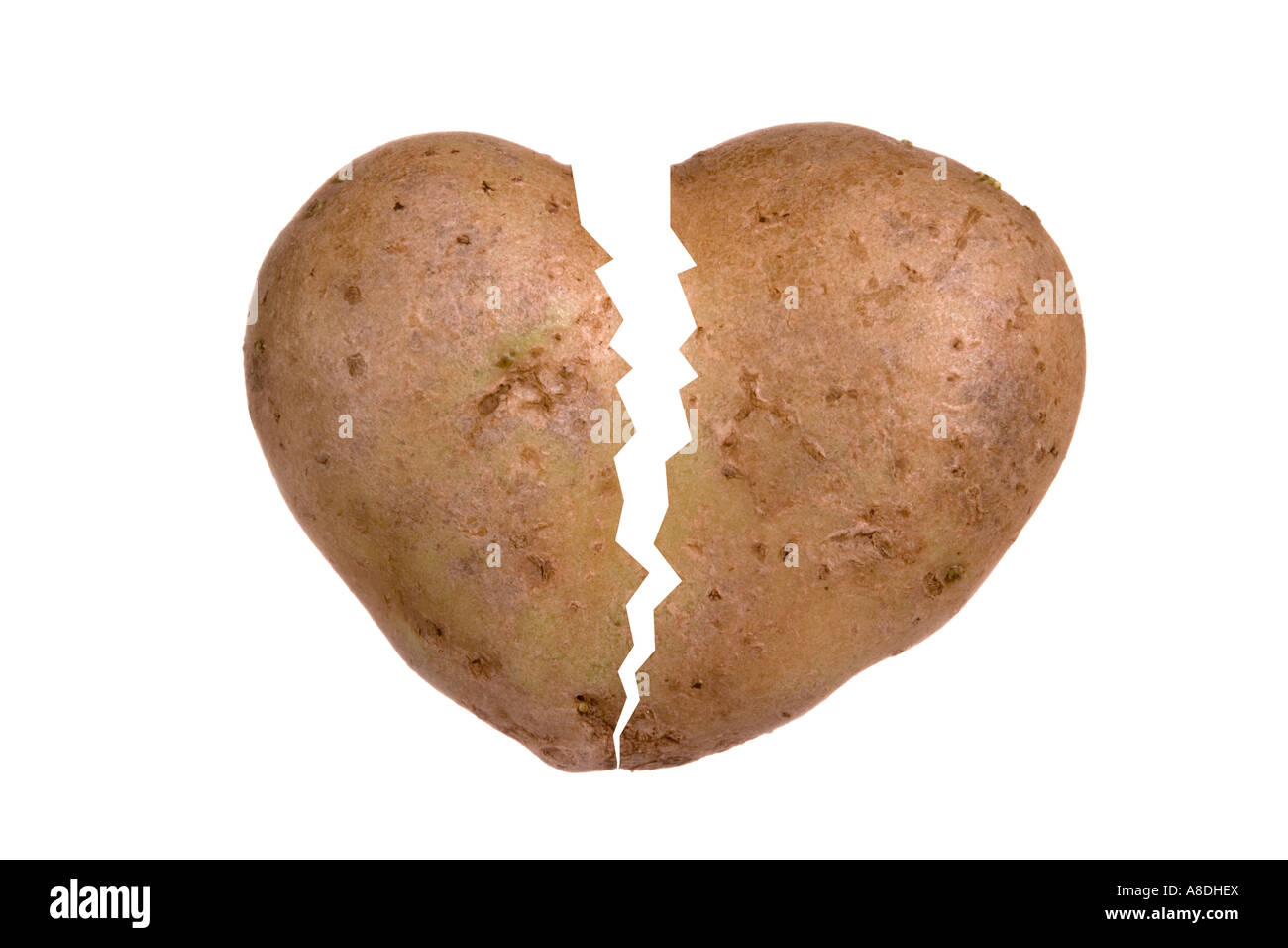 Broken heart shaped potato isolated on a white background Stock Photo ...
