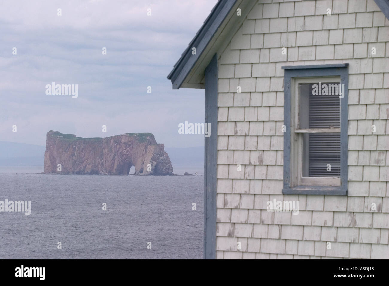 Traditional french canadian house and view of Rocher Percé on ...
