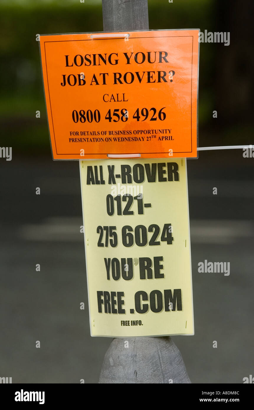 Signs offering former MG Rover employees new jobs attached to a ...