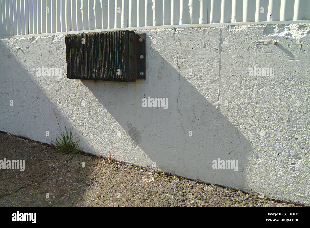 A rubber bumper made of recycled tires at a truck loading dock Stock ...