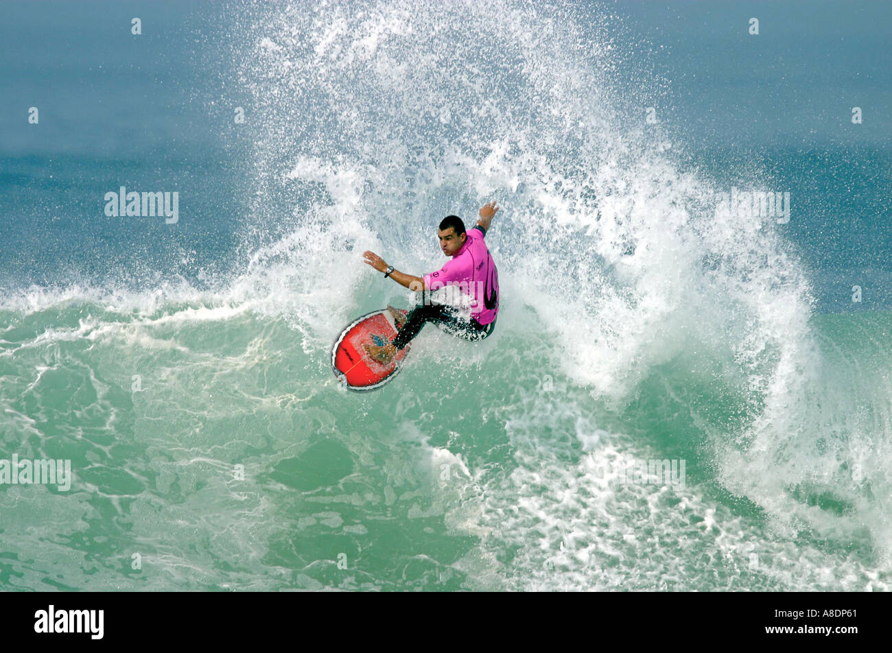 Surfer riding a Wave Stock Photo - Alamy