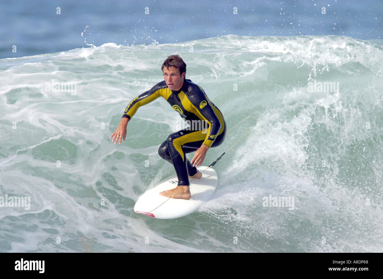Surfer riding a Wave Stock Photo - Alamy