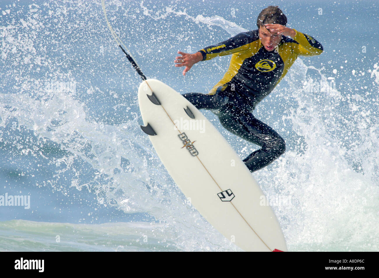 Surfer riding a Wave Stock Photo - Alamy
