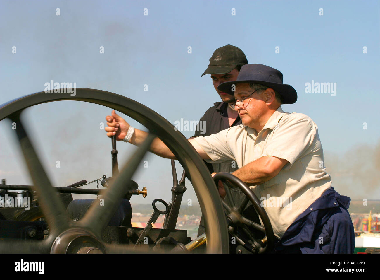 Traction engine operator at Dorset Steam Fair, England, UK Stock Photo ...