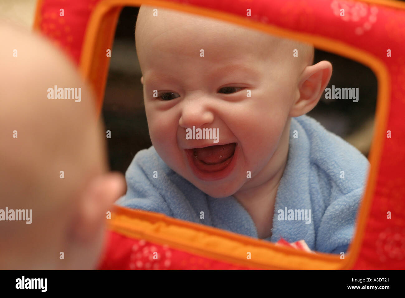 baby seeing self in mirror Stock Photo - Alamy