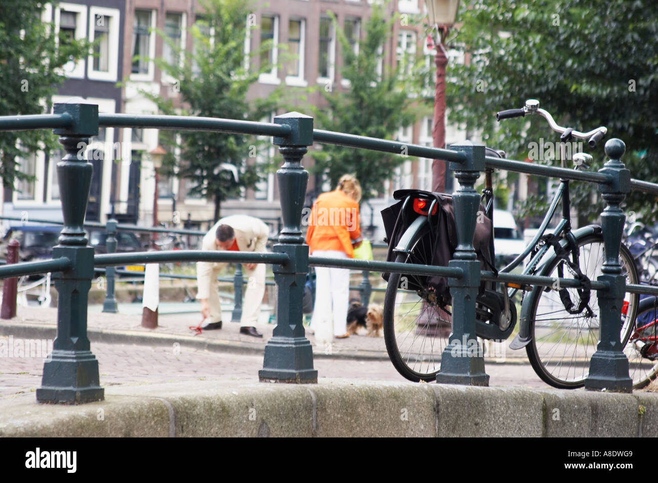 Men lean against railing outside hi-res stock photography and images ...