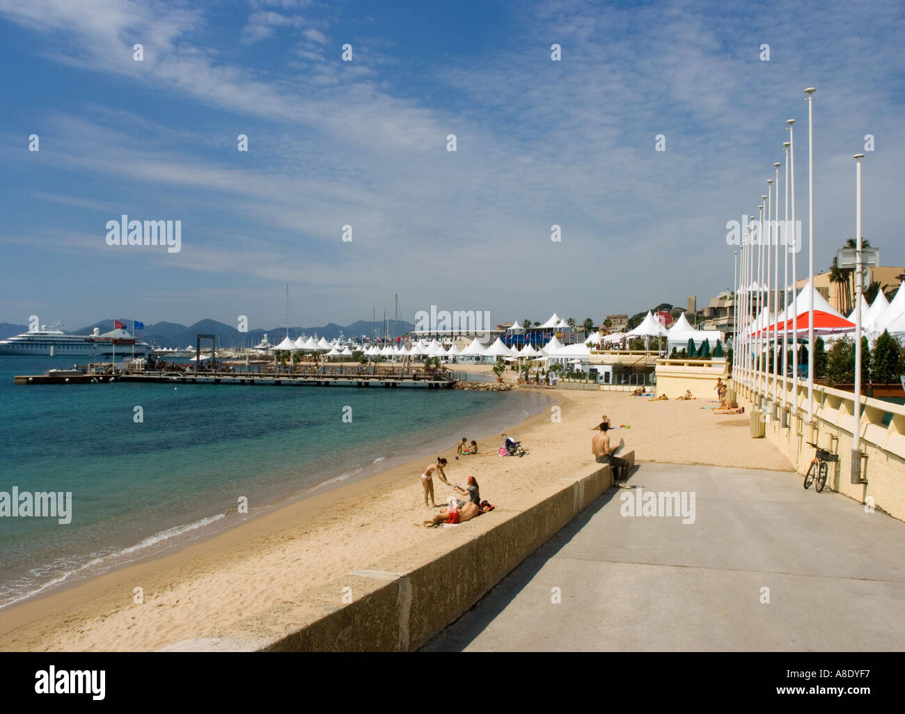 The beach at Cannes during the film festival with many luxury yachts ...