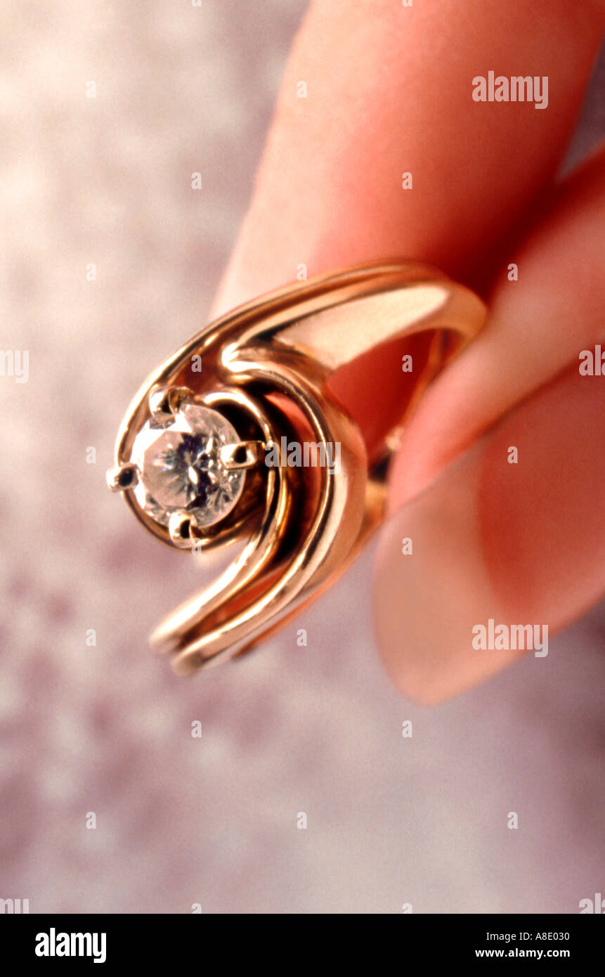 Hand holding diamond ring Stock Photo - Alamy