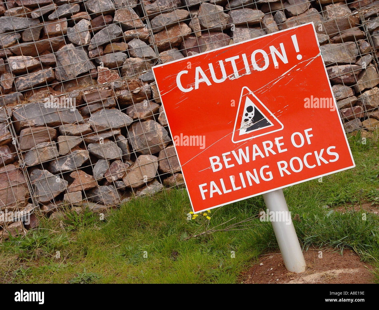 Falling rocks warning sign on Sandy Bay Beach near the town of Exmouth ...