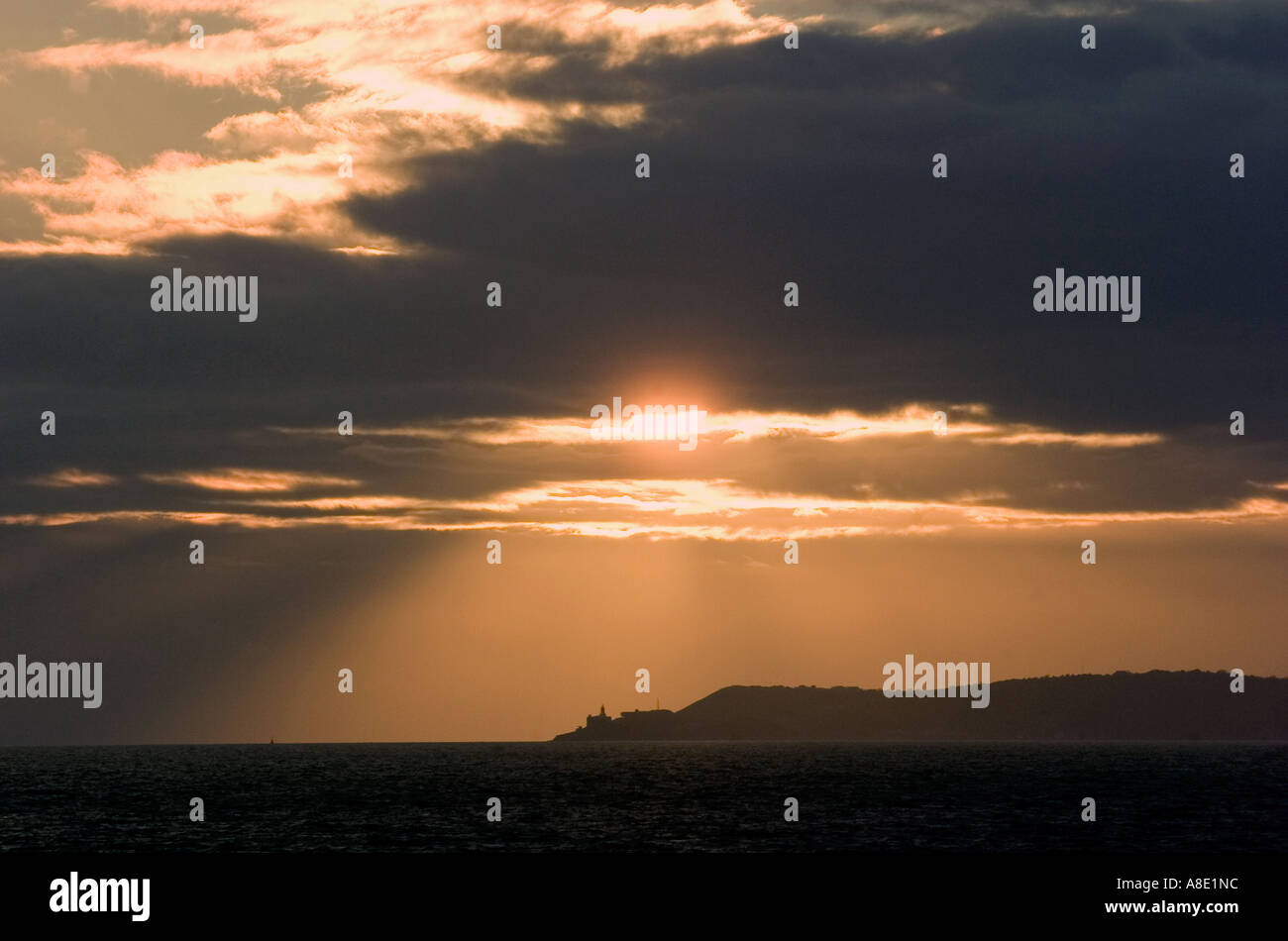 Mumbles headland pictured at sunset from the seafront at Aberavon, Port ...