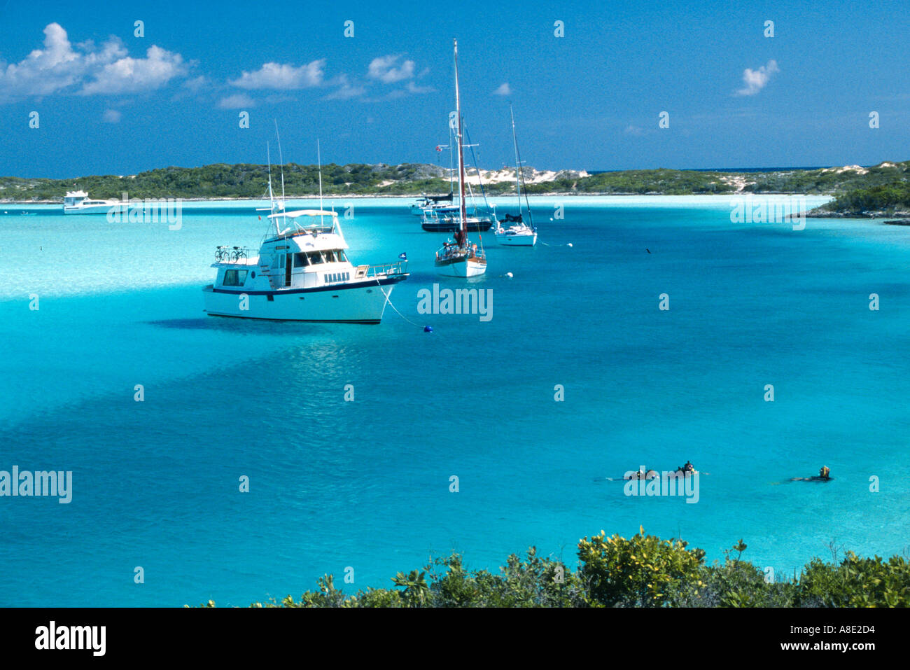 Boats moored in channel at Warderick Wells Cay HQ Exumas Land and Sea ...
