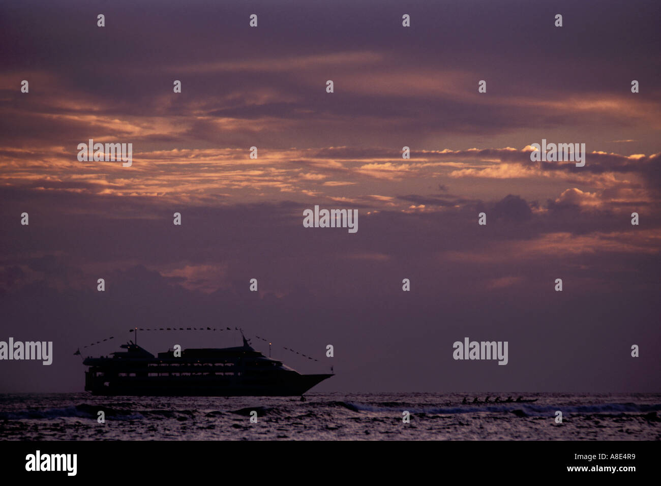 Sunset Cruise Ship and Dugout Canoe Off Waikiki Beach in Mamala Bay on ...