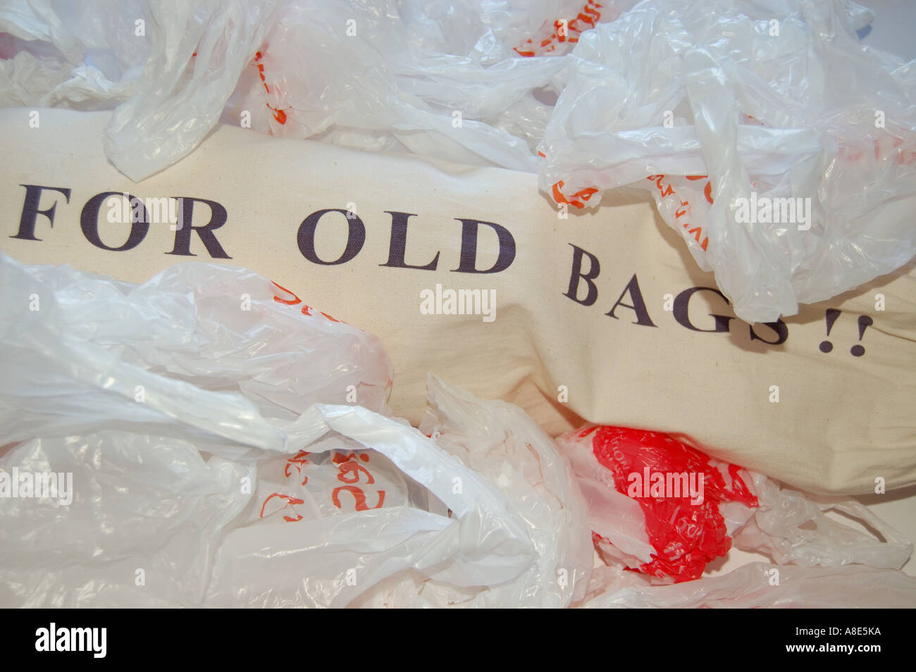 A pile of used plastic shopping bags reading for reuse and recycling ...