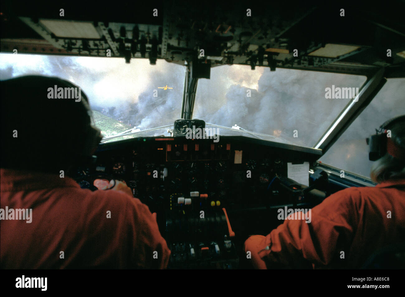 Pilots inside the cockpit of a Canadair firefighting water bomber ...