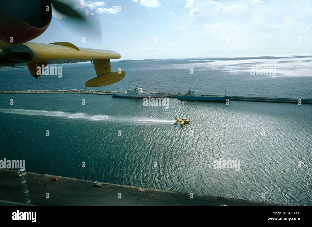 Aerial view of a Canadair firefighting water bomber airplane scooping ...