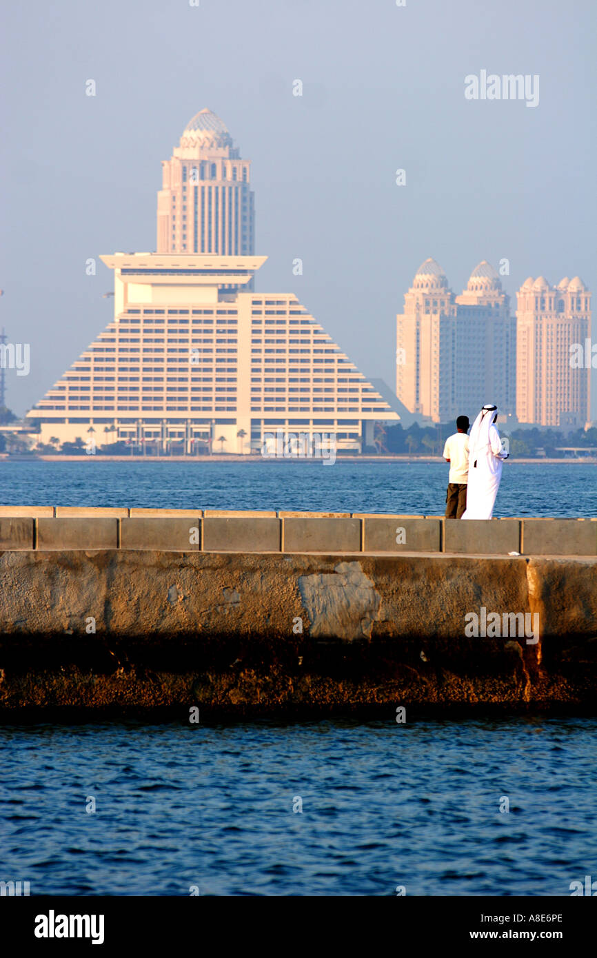 Two people walking in Doha, Qatar Stock Photo - Alamy