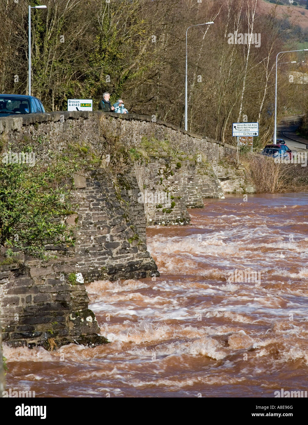 People watching floodwater on river Usk Abergavenny Wales UK Stock ...
