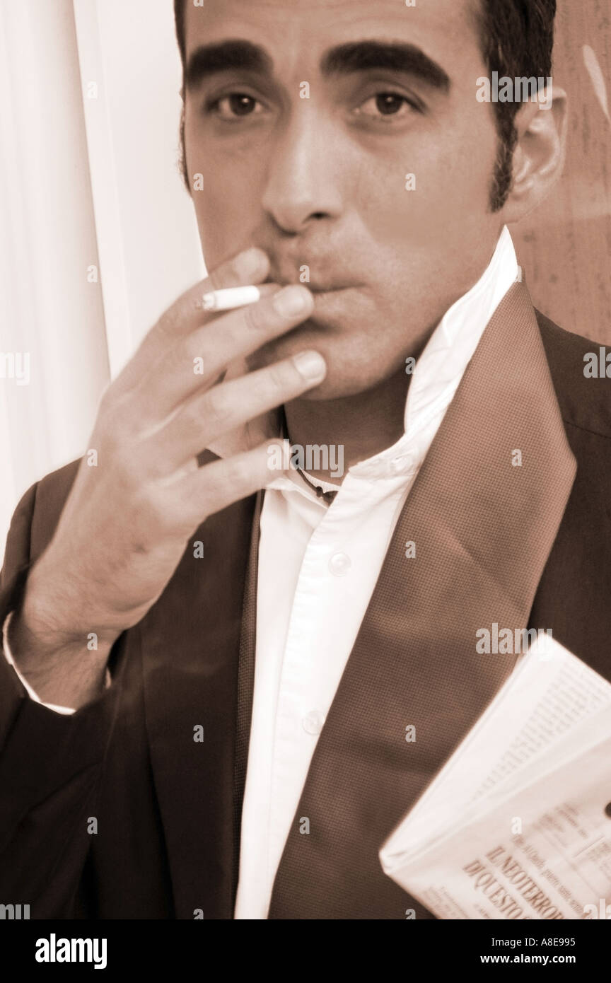 Smoking businessman put under stress Stock Photo - Alamy