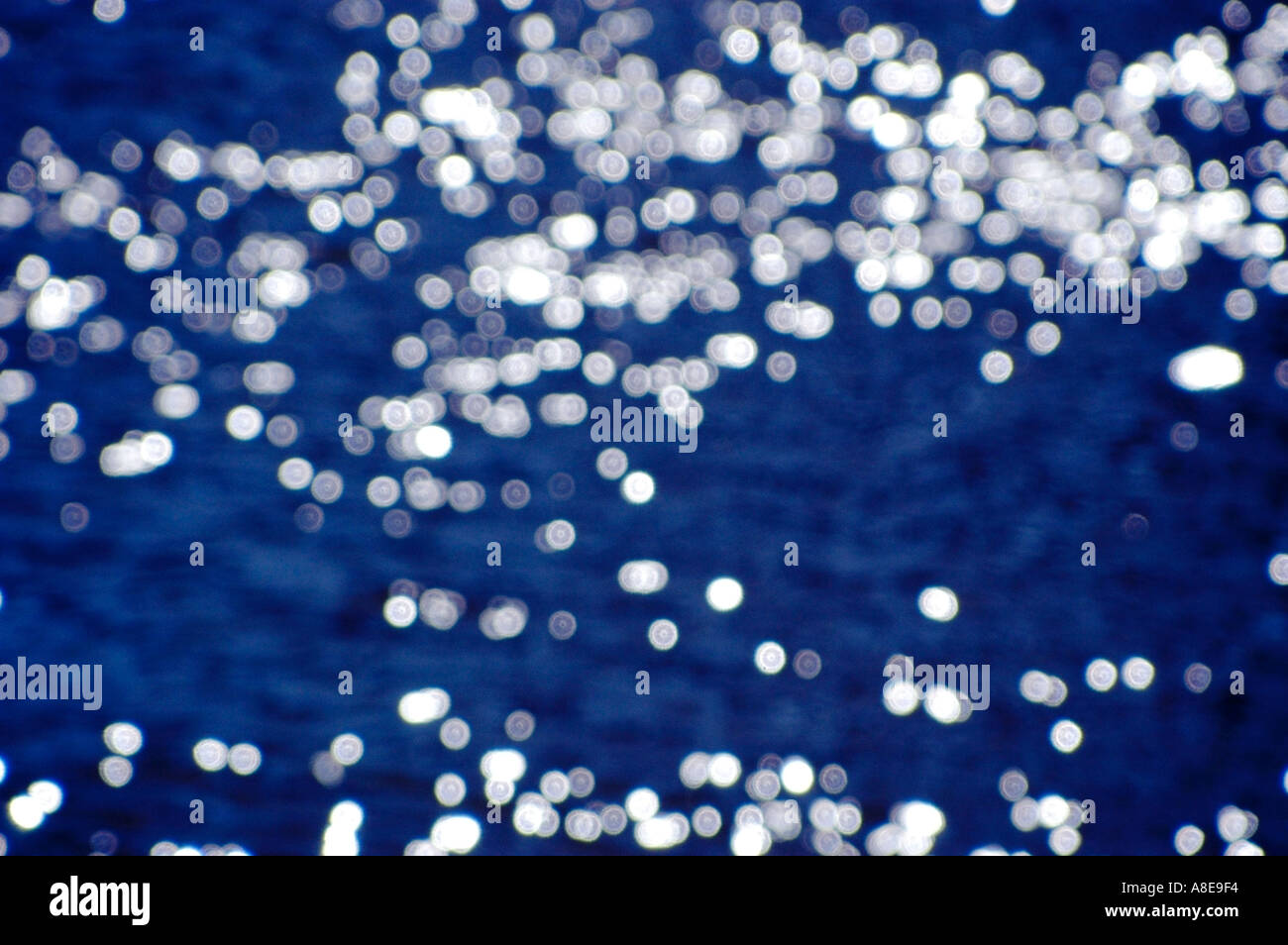 Sun reflexes in the water Stock Photo - Alamy