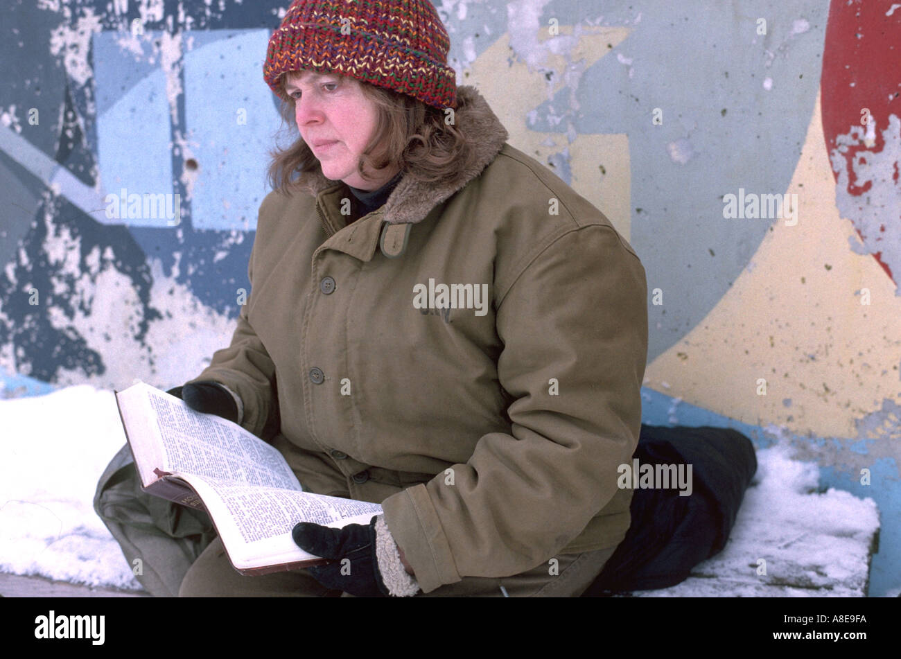 Homeless woman age 41 reading bible in the dead of winter. St Paul ...