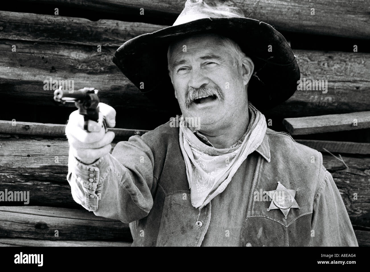 Sheriff cowboy reenactor gun pointed hi-res stock photography and ...