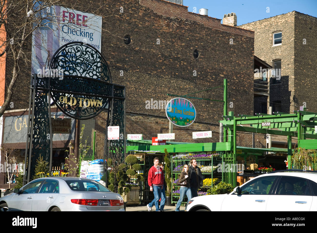 CHICAGO Illinois Old Town sign traffic on Wells Street pedestrians walk ...