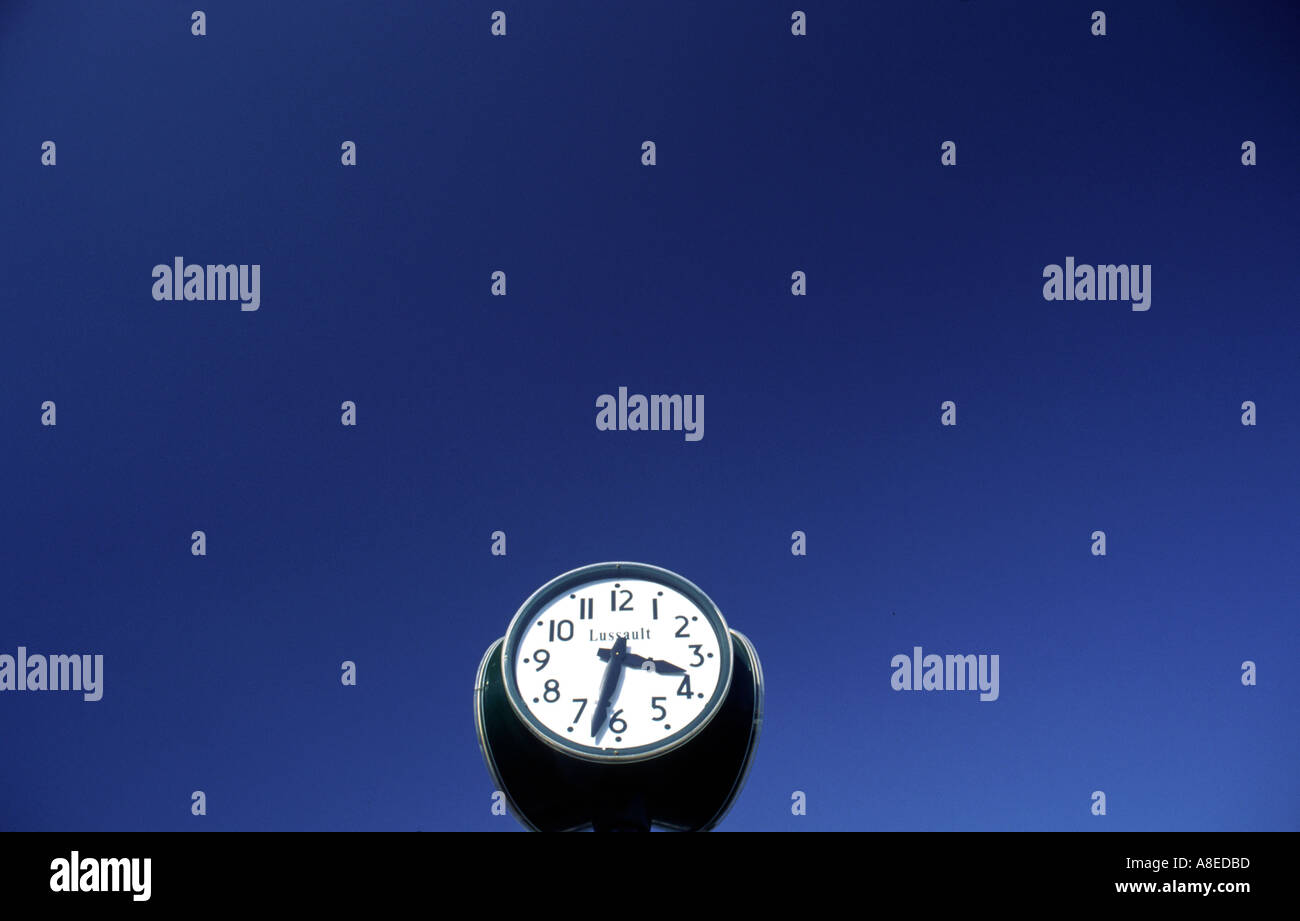Large clock in the sky Stock Photo - Alamy
