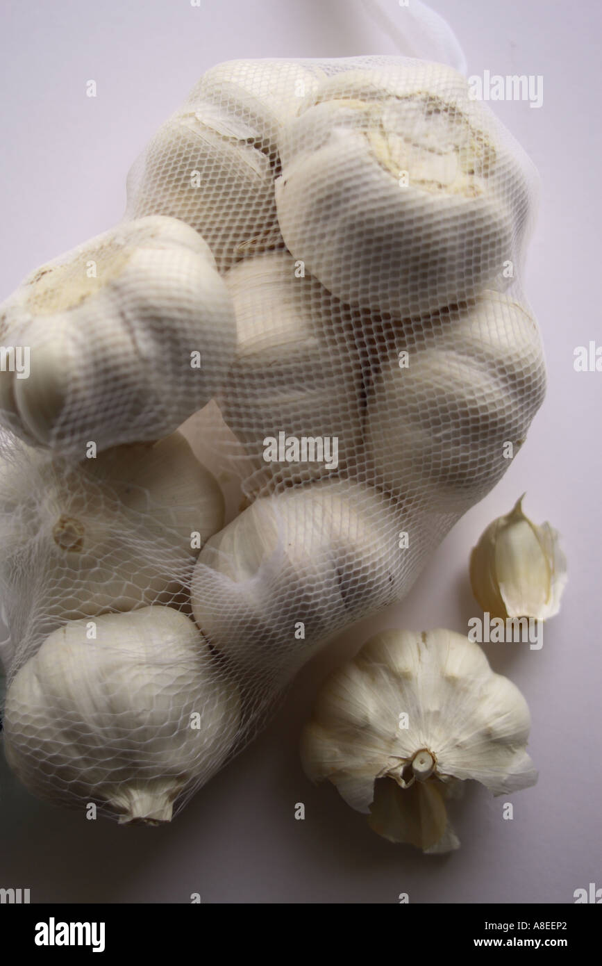 Bag of Garlic with an opened bulb with a clove A strong smelling ...