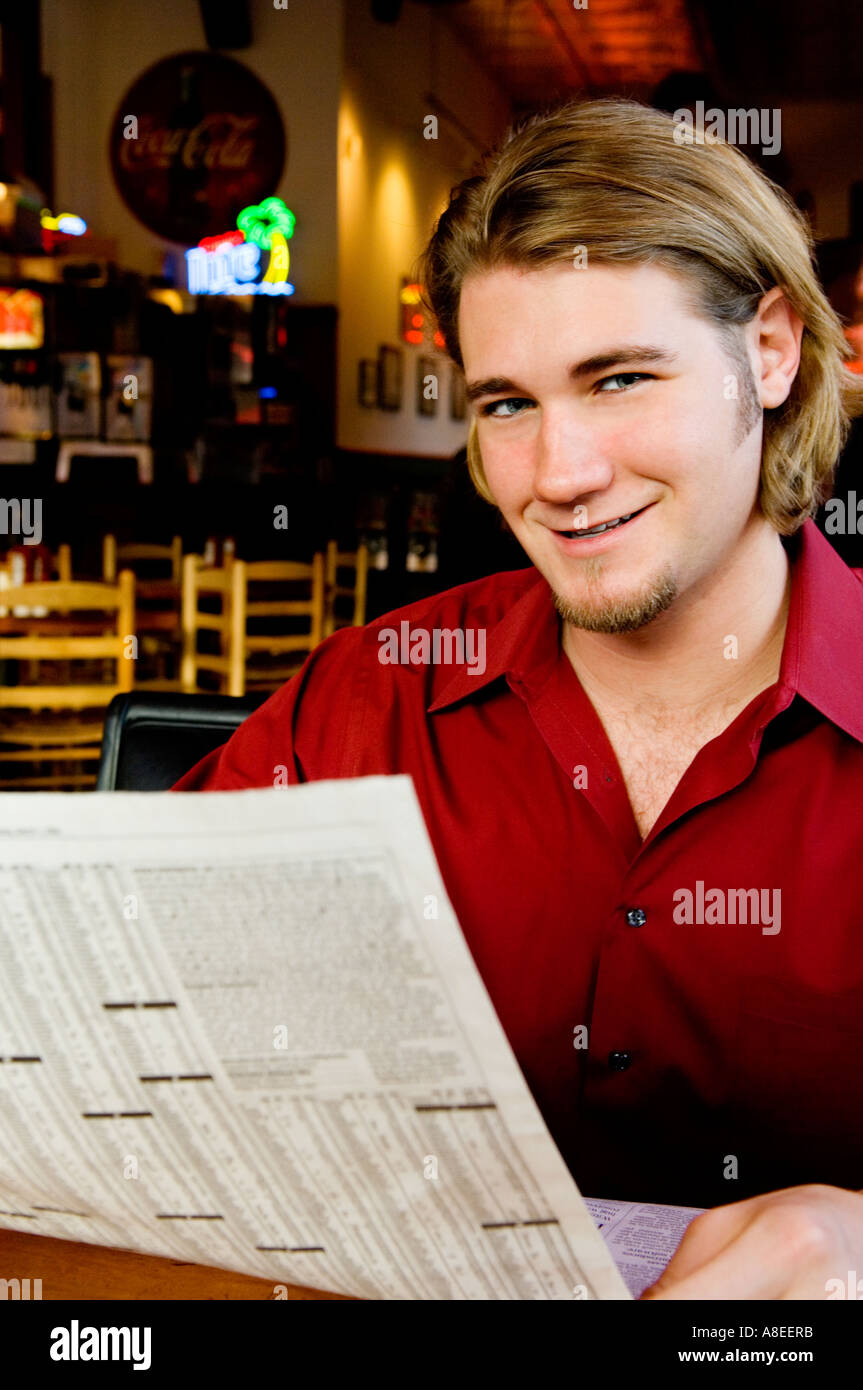 blonde gentleman reading the paper in a breakfast diner Stock Photo - Alamy