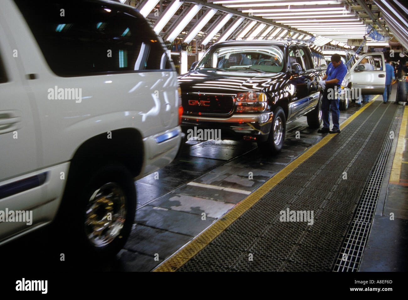 A final quality check as Chevrolet Suburbans roll off the assembly line ...