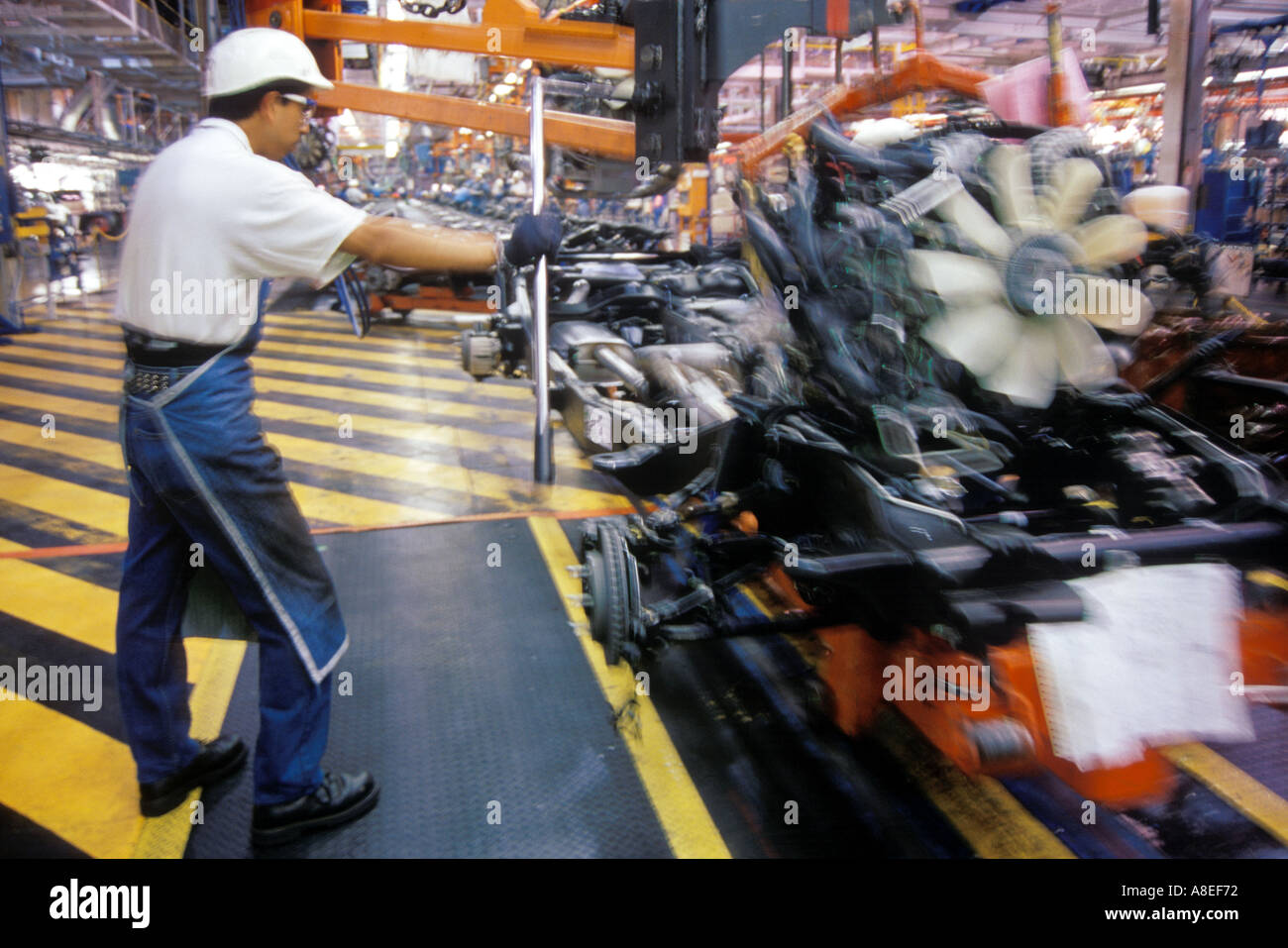 Worker on an engine assembly line at the Chevrolet Suburban plant in ...