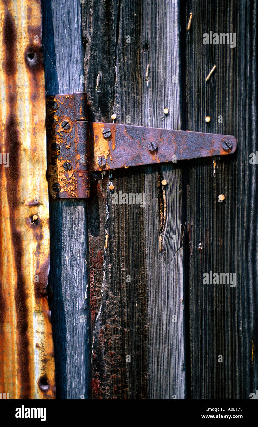 detail of old wooden door with rusted hinge weathered wood and rusted ...