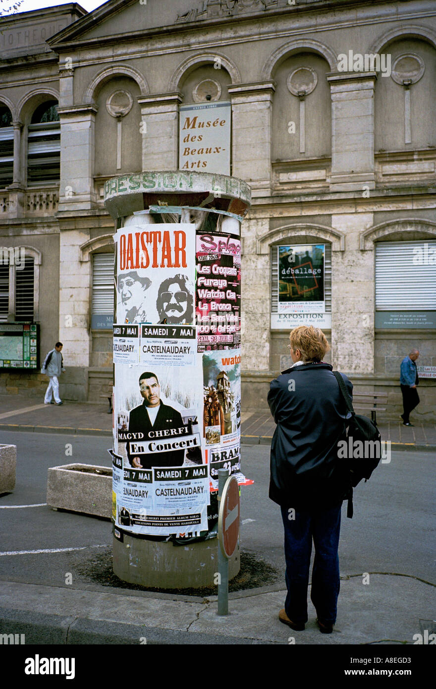 Viewing advertising posters in Nice, on the Cote d'Azur, France, French ...