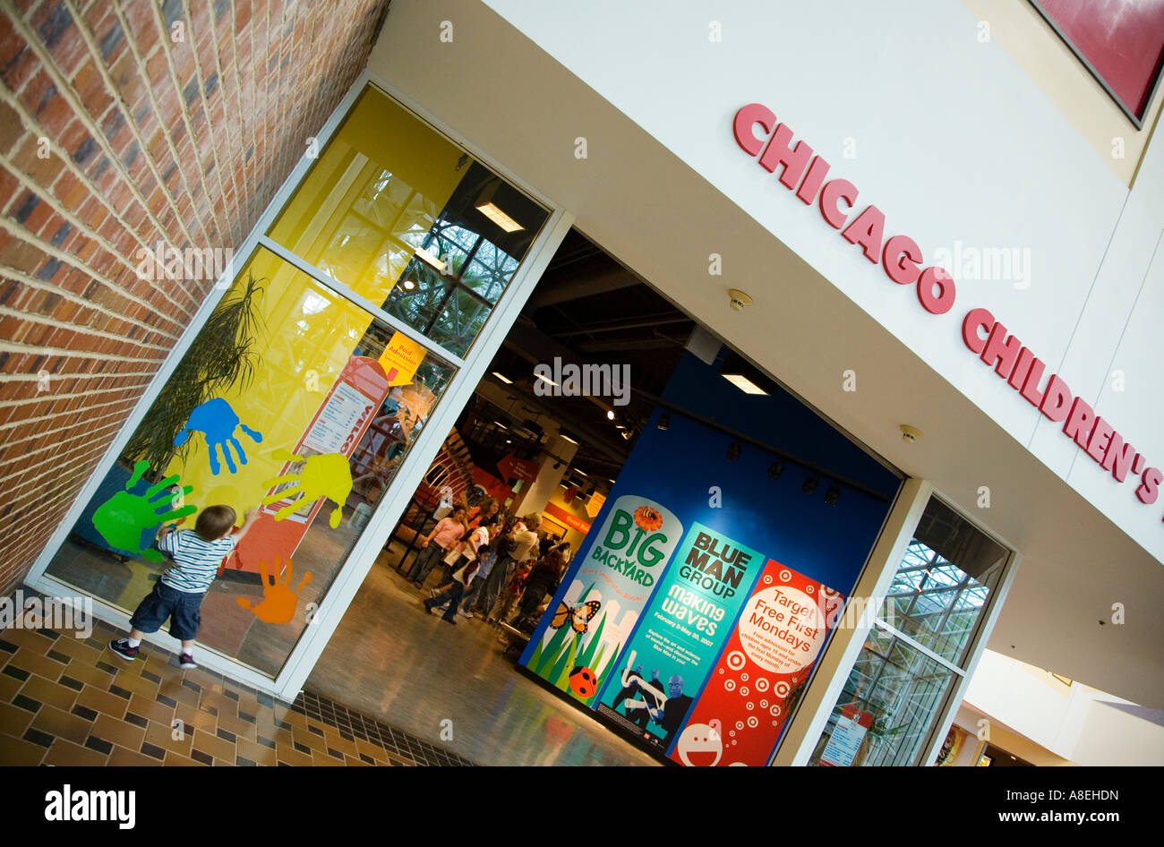 CHICAGO Illinois Toddler boy put hand on handprints Childrens Museum at ...