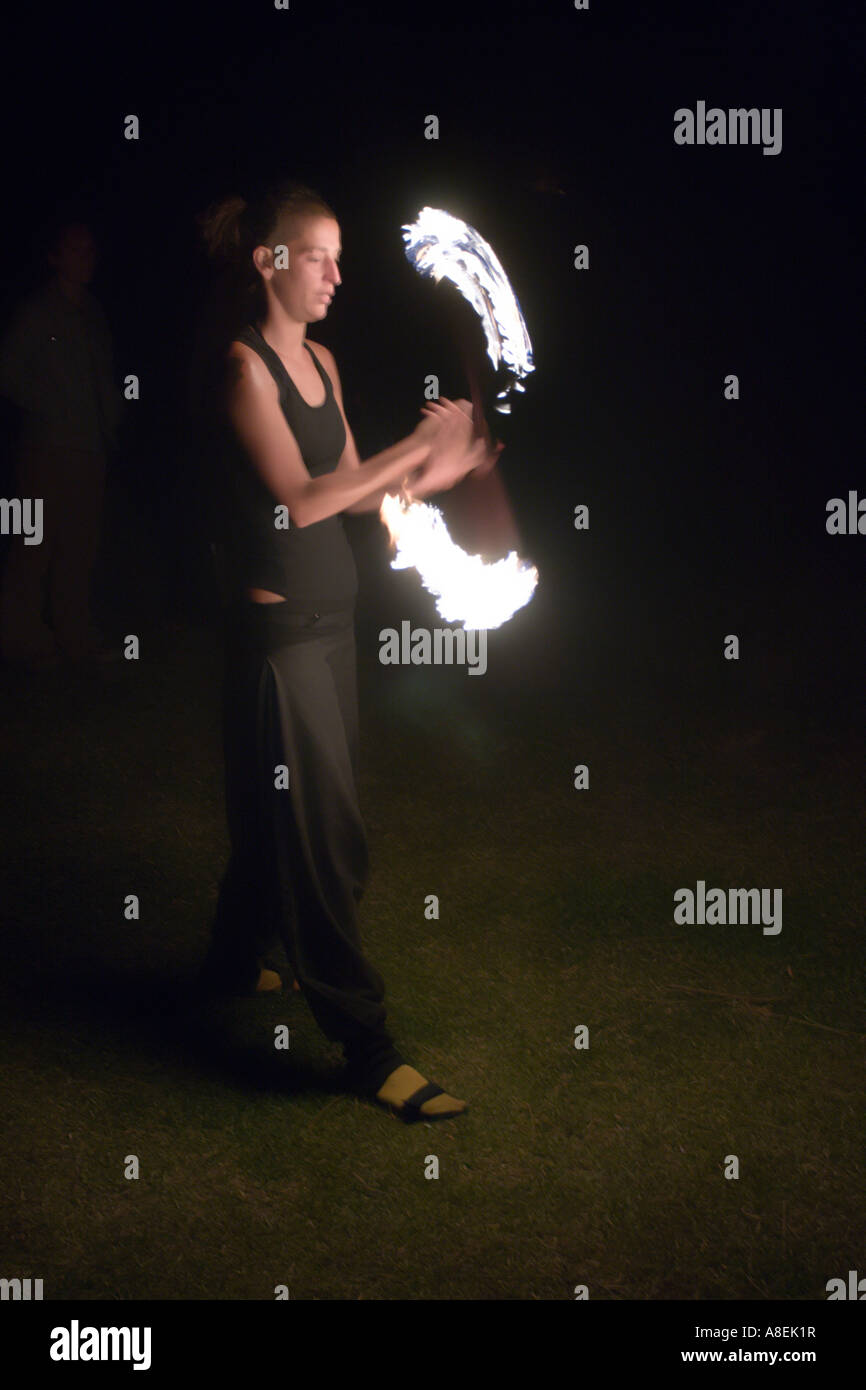 Juggler woman making some juggle with fire Stock Photo - Alamy