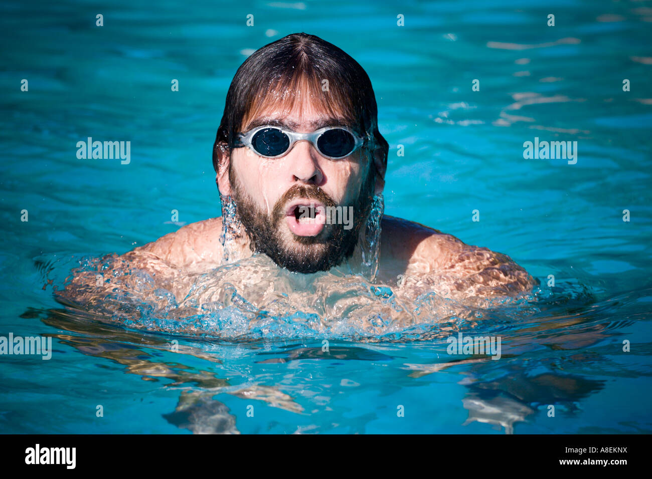 Bearded man swimming in a pool Stock Photo - Alamy