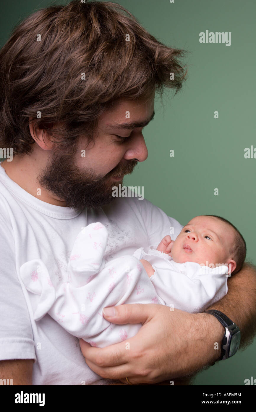 Young father holing his newborn baby Stock Photo - Alamy