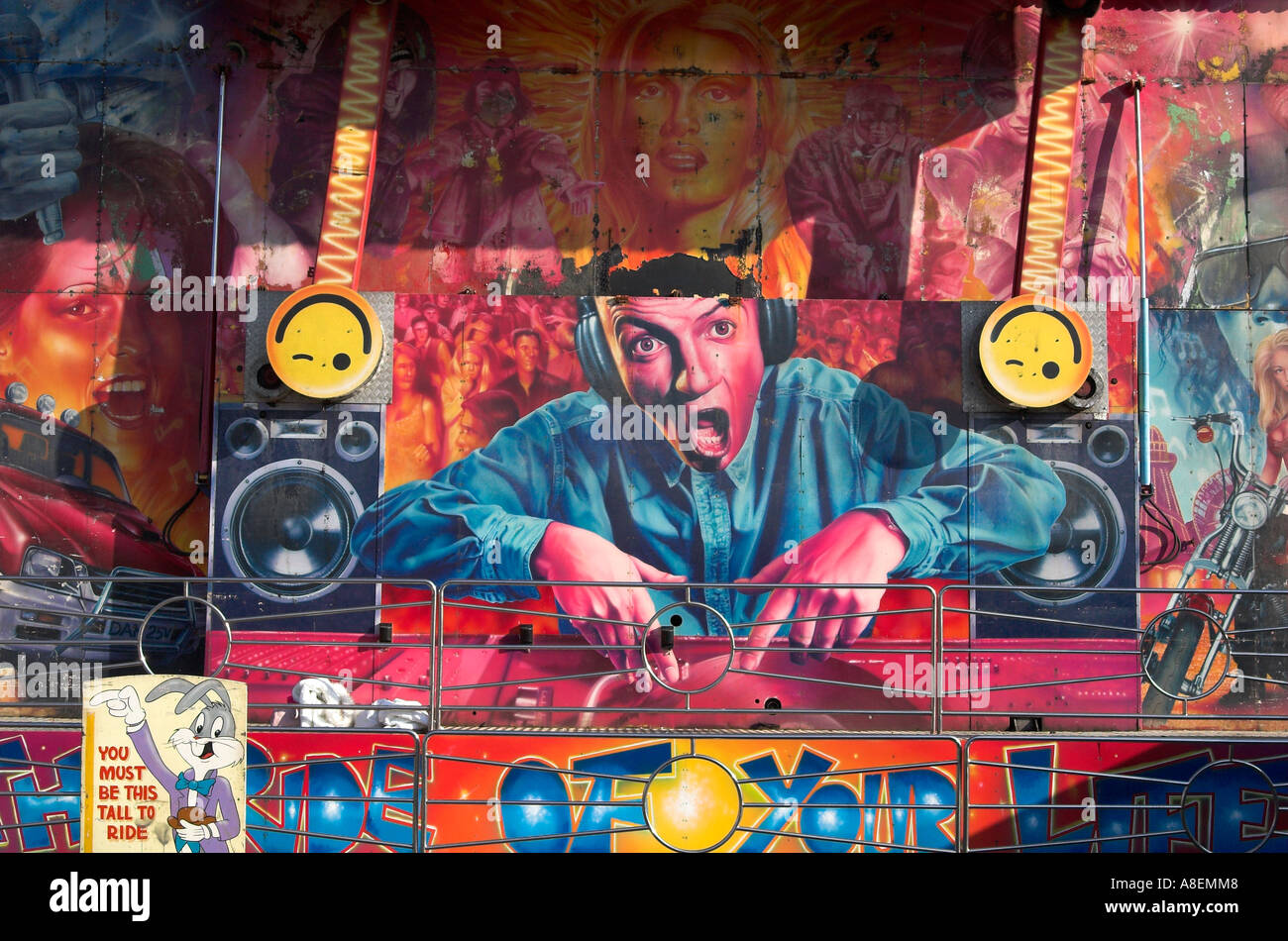 Brightly coloured backdrop to a fairground ride, travelling fair ...