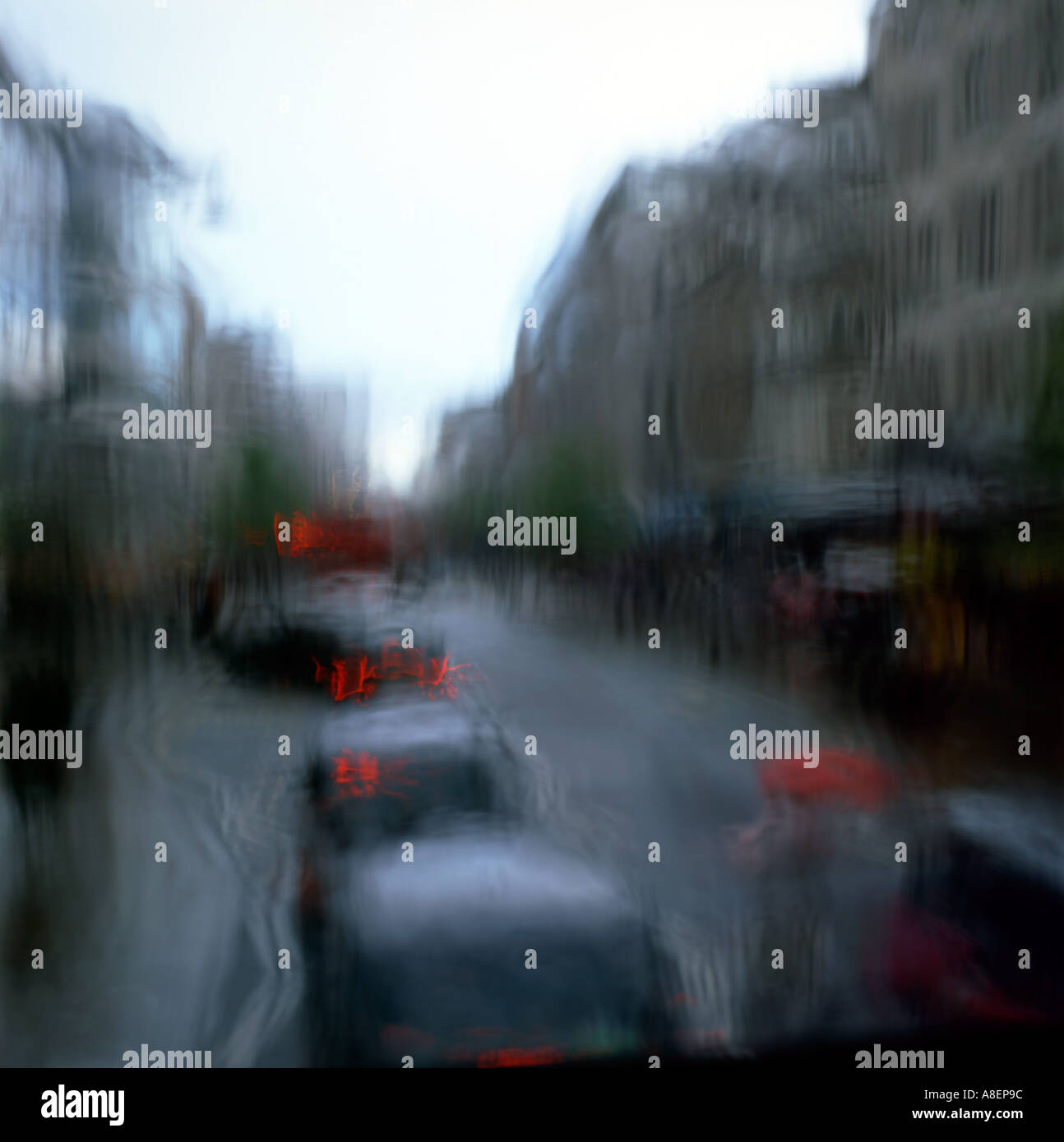 A view of a queue of black taxi cabs on Oxford Street looking out of a ...