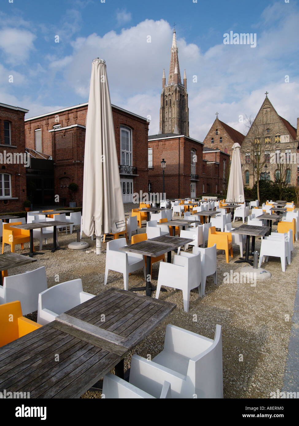 Pavement cafe with empty tables and chairs in the historic centre of ...