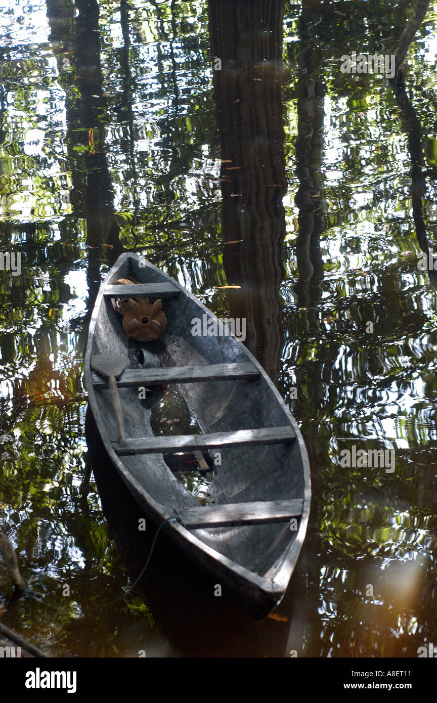 canoe floating in amazon river Stock Photo - Alamy