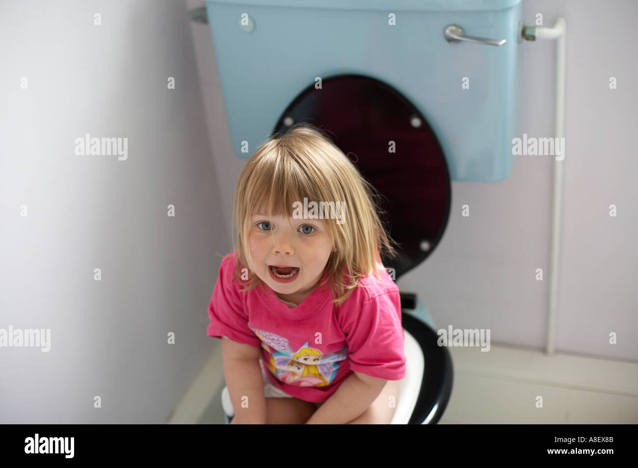 small girl on the toilet Stock Photo - Alamy