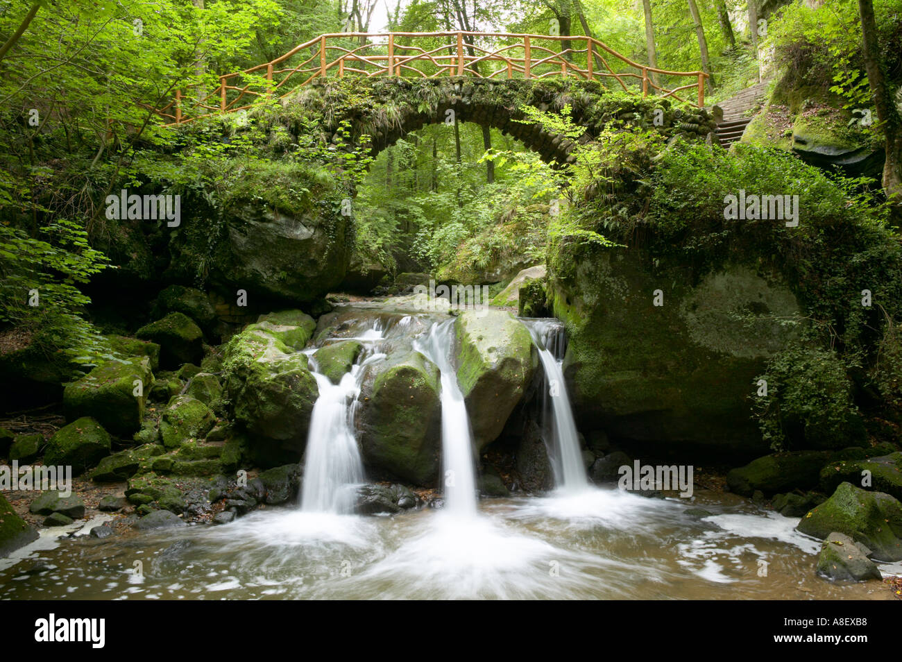 The old stone bridge called the Scheissentempel, Mullerthal near ...