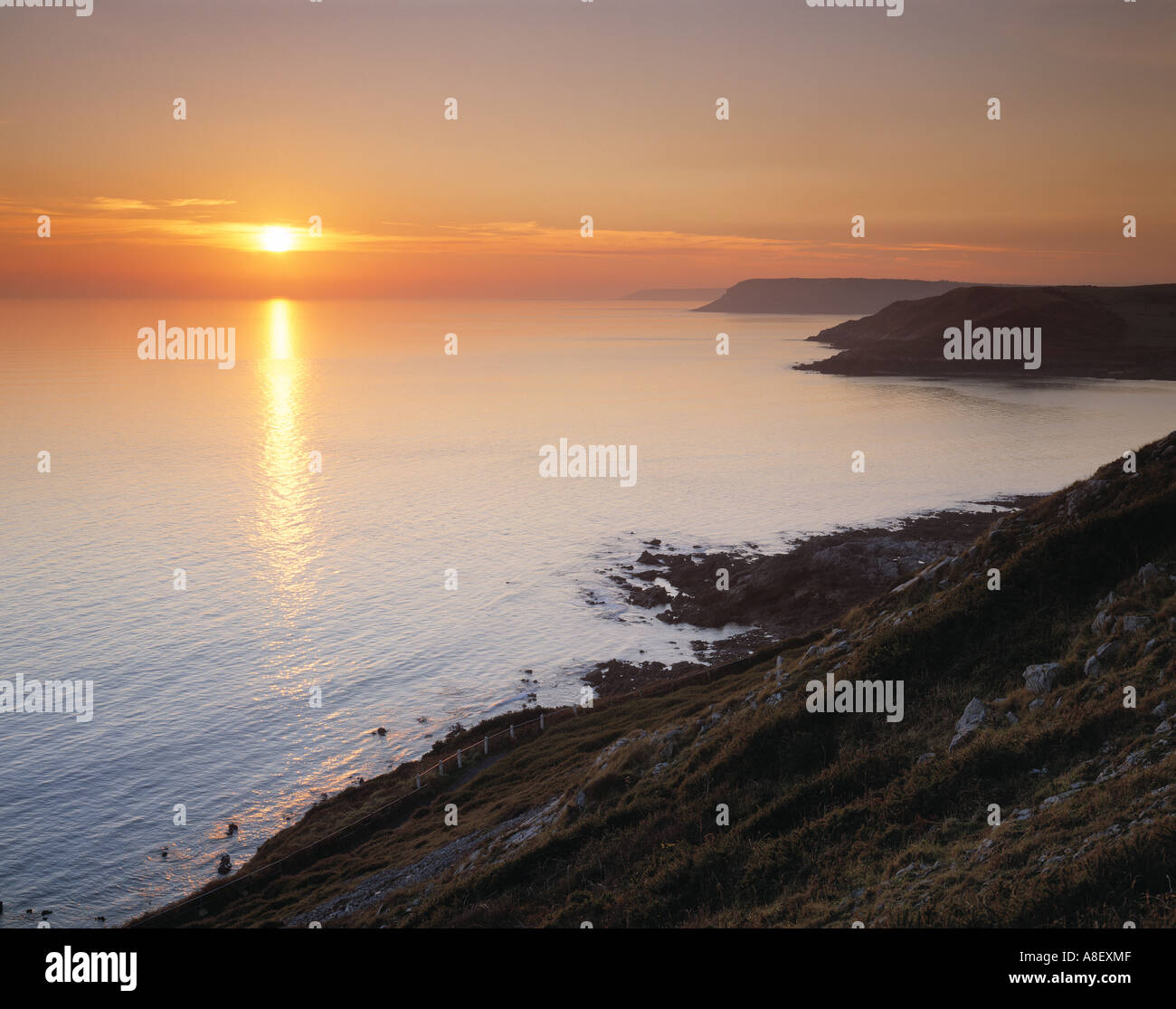 SUNSET OVER CASWELL BAY THE GOWER SOUTH WALES UK Stock Photo - Alamy