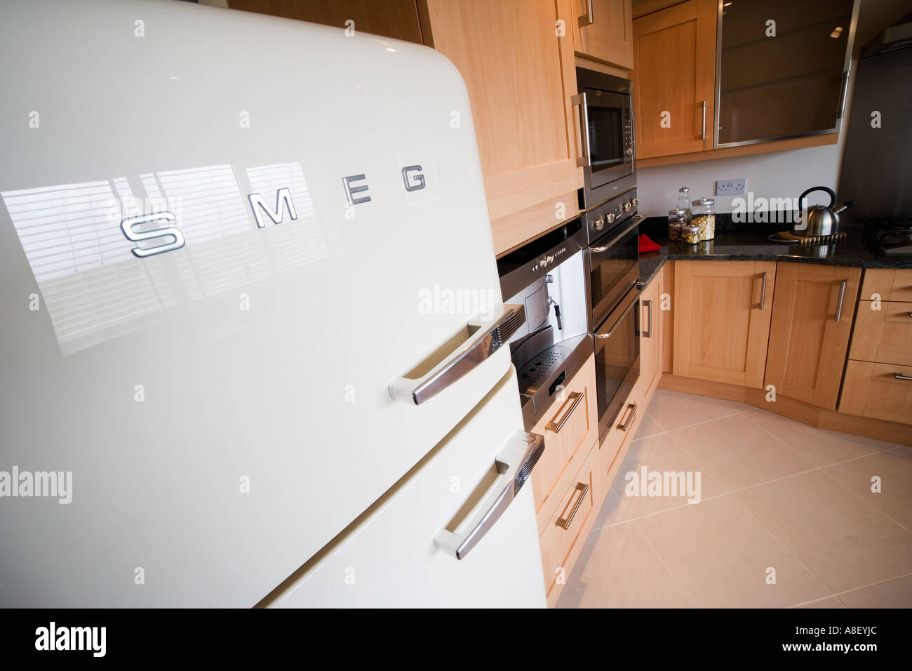 FRIDGE FREEZER IN MODERN KITCHEN IN SHOW HOME UK Stock Photo - Alamy