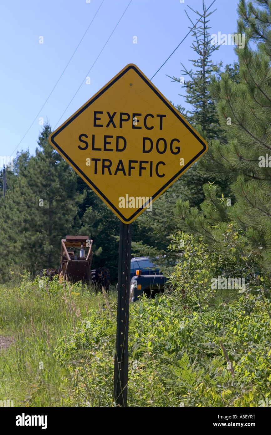 Warning sign for a dogsled crossing Stock Photo - Alamy