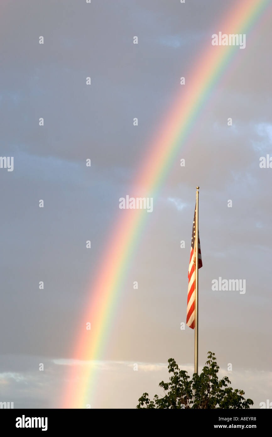 American flag with storm clouds and rainbow Stock Photo - Alamy
