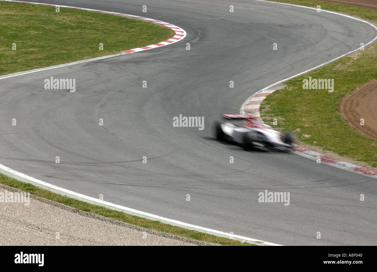 Formula 1 racing car on a track with curves Stock Photo - Alamy