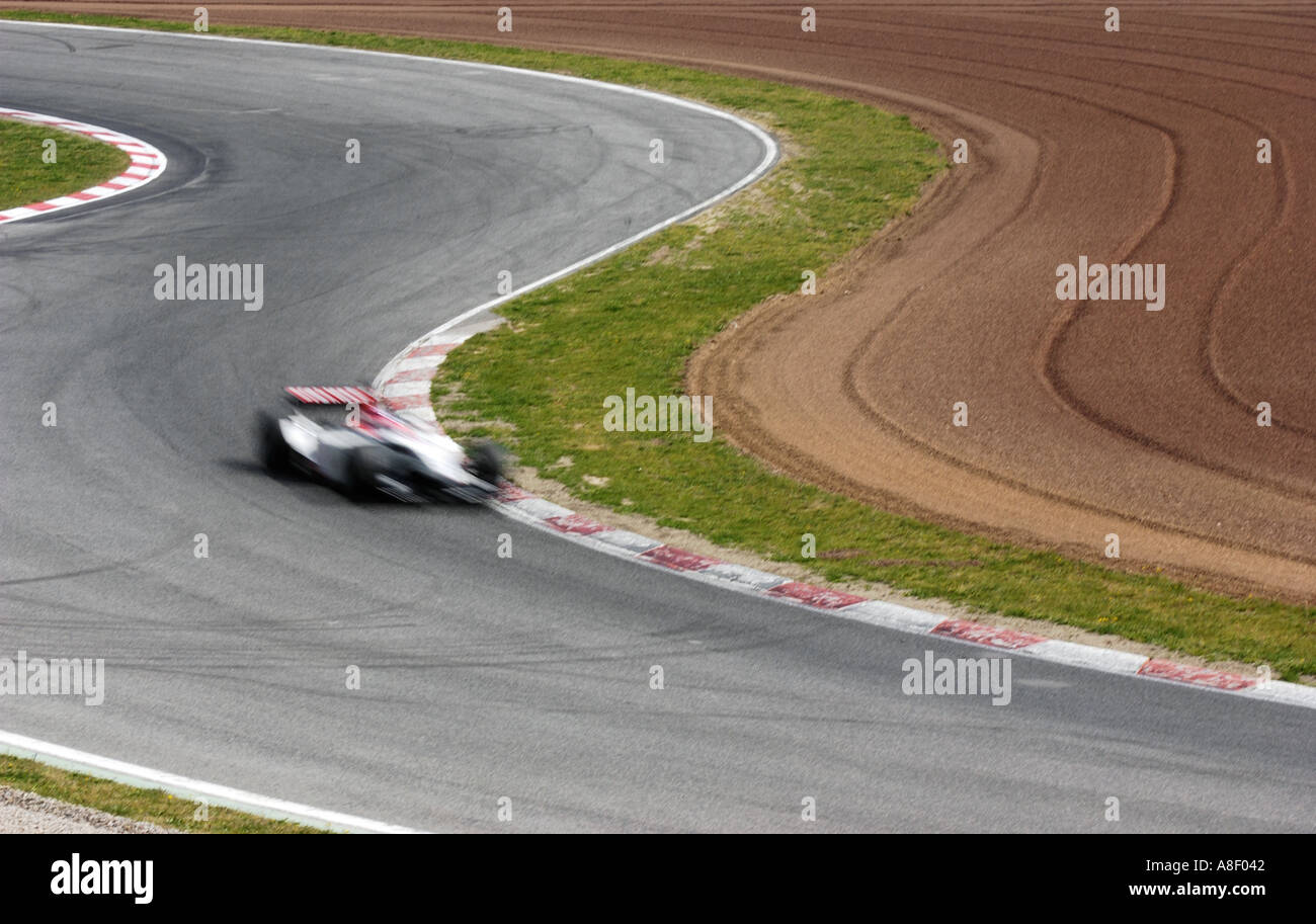 Formula 1 racing car on a track with curves Stock Photo - Alamy